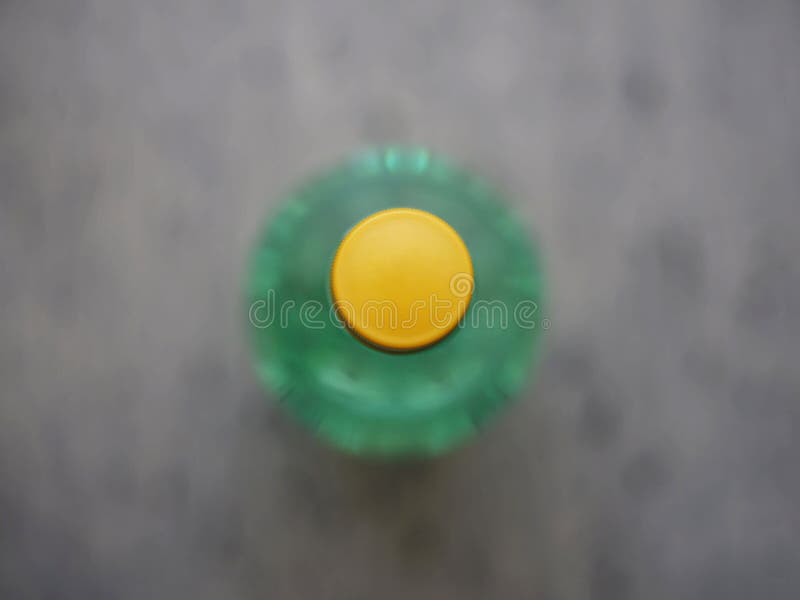 Yellow Cap of Green Plastic Bottle - Top View Stock Image - Image of ...
