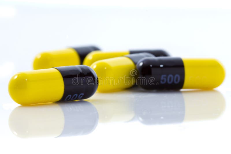 Yellow capsule stock photo. Image of black, multicolored - 22176062