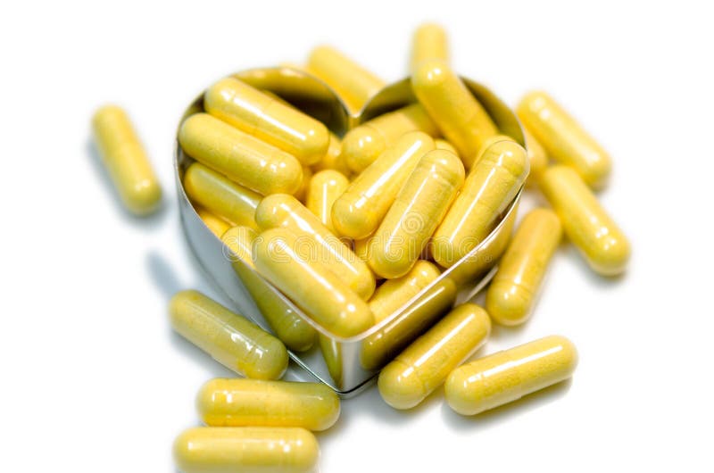 Yellow capsule heart stock photo. Image of healthcare - 43035882