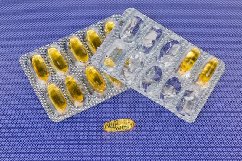 Yellow Capsules in Blister Packing and One Capsule Lies Separately ...