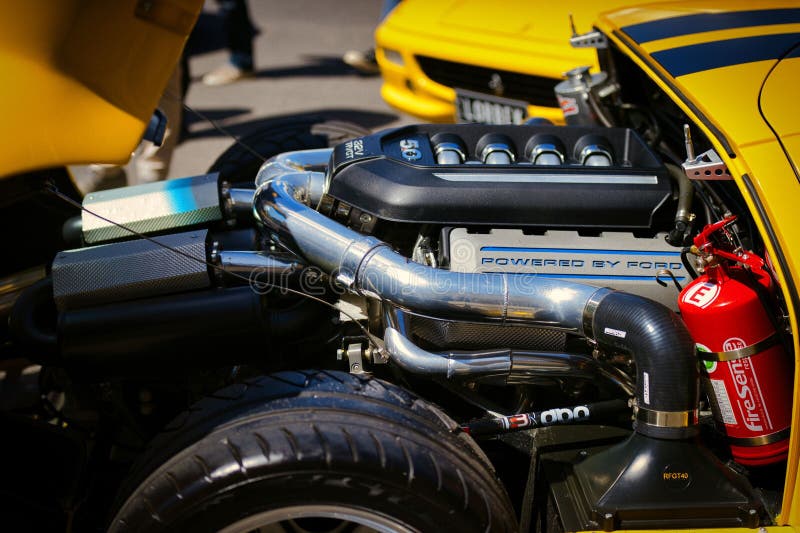 A Yellow Car Has a Big Engine in it S Rear End Editorial Image - Image ...