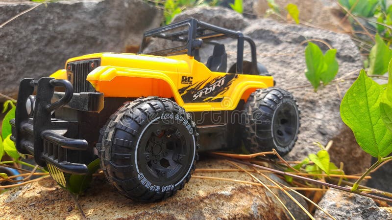 Yellow Car on a Rocky Mountain with Green Natural Views Stock Photo ...