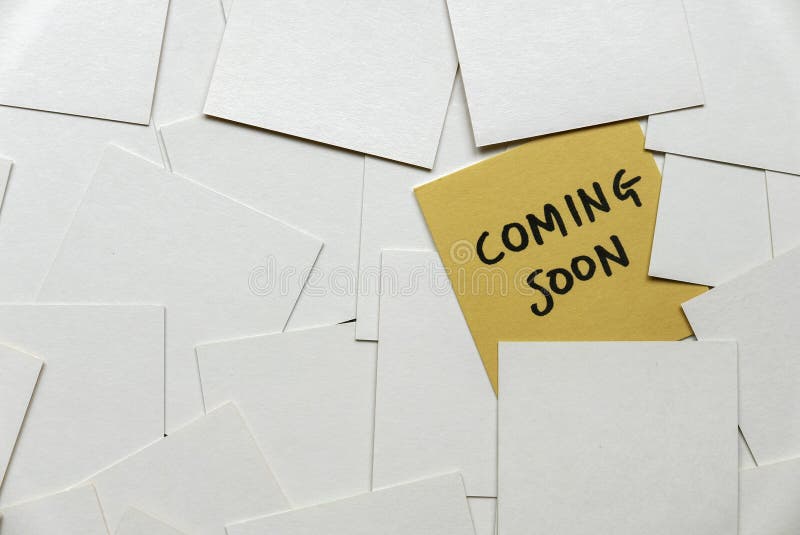 A Yellow Card among an Empty White Card Written with Coming Soon Stock ...