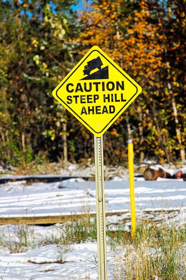 A Caution Steep Hill Sign on a Edge of a Trail Stock Photo - Image of ...