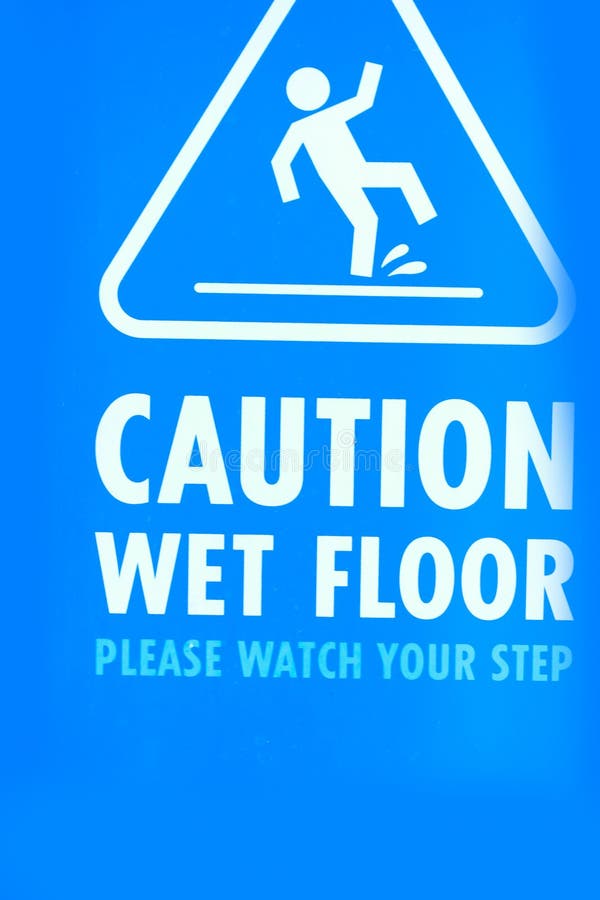 Yellow Caution Wet Floor Sign on Wet Floor Stock Photo - Image of ...