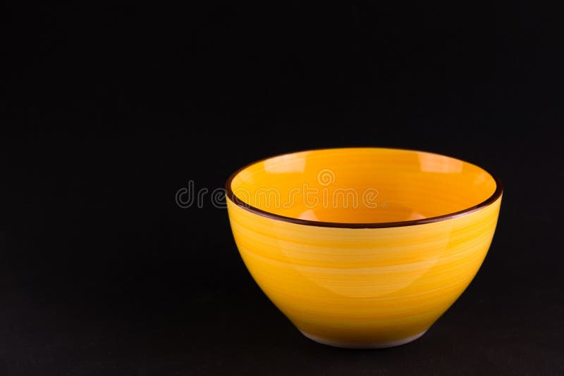 Yellow Ceramic Bowl on Black Background Copy Space Stock Photo - Image ...