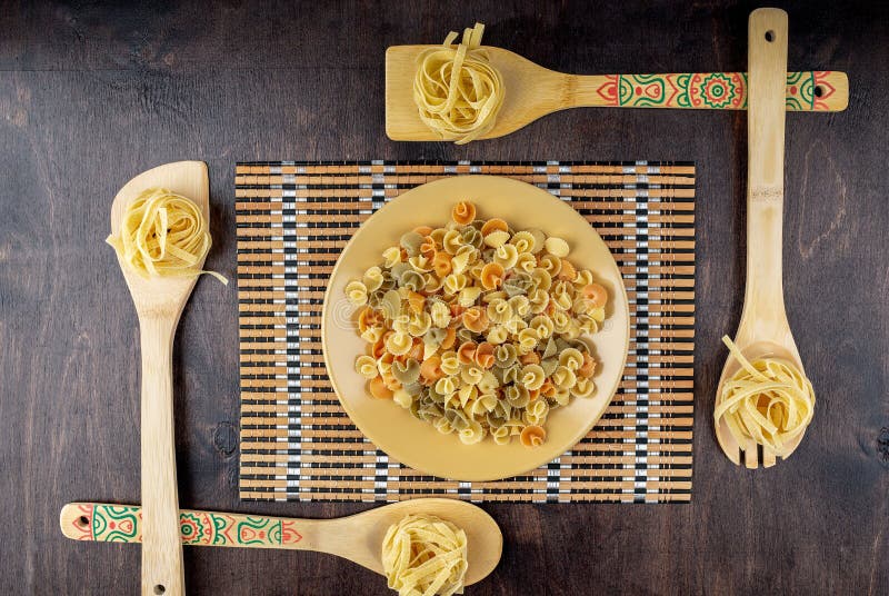 Yellow Ceramic Plate with Dry Multicolored Paste on a Bamboo Napkin ...