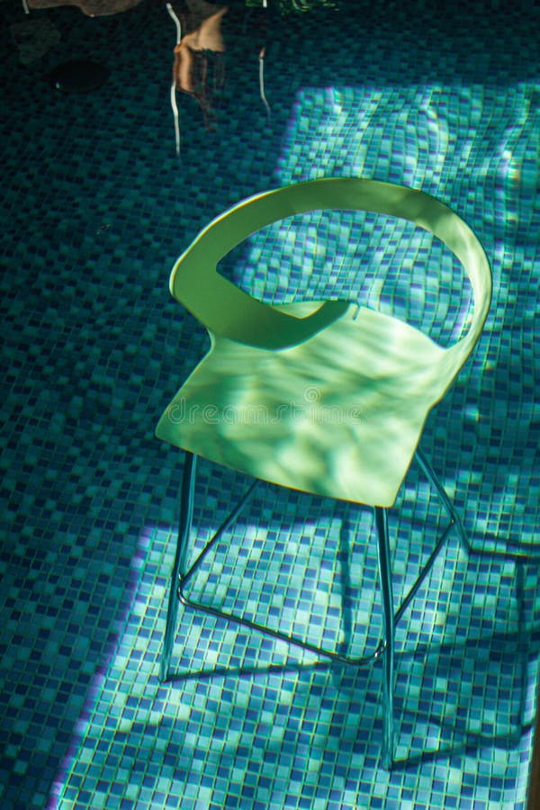 Yellow Chair in a Pool of Water. Deep Tile Stock Image - Image of ...