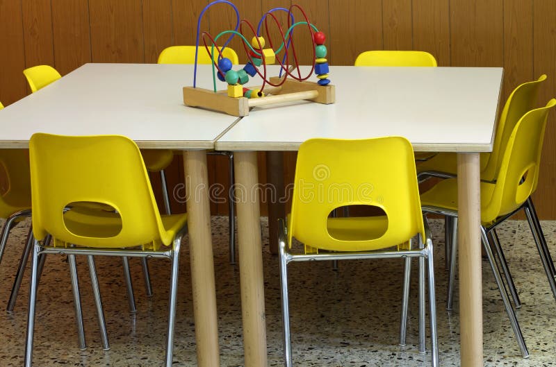 Yellow Chairs with a Toy Over the Bench Stock Photo - Image of ...