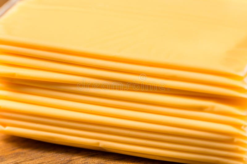 Yellow Cheddar American Cheese Singles Stock Photo - Image of food ...