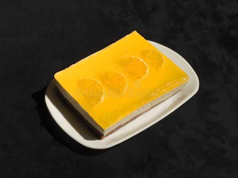 Yellow Cheesecake with Oranges on Black Background Stock Photo - Image ...