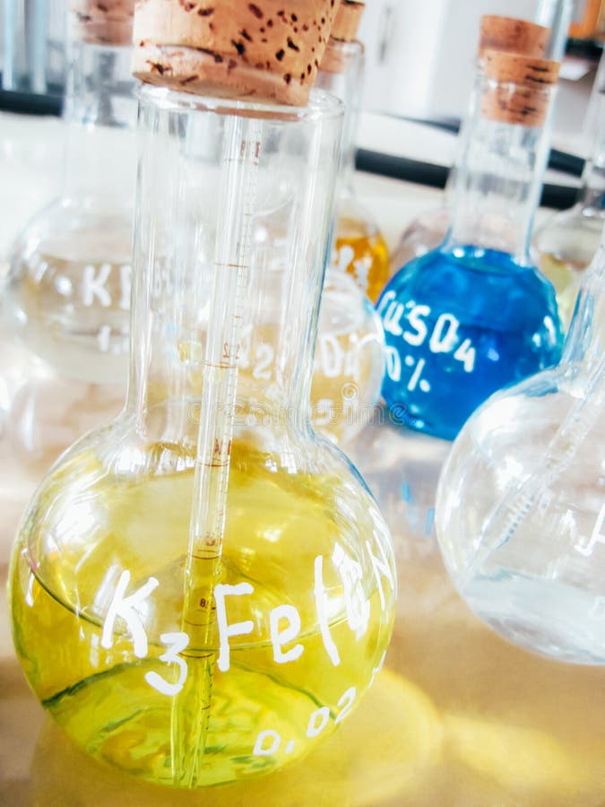 Yellow Chemical Powder in the Clear Plastic Bottle with a Gray ...