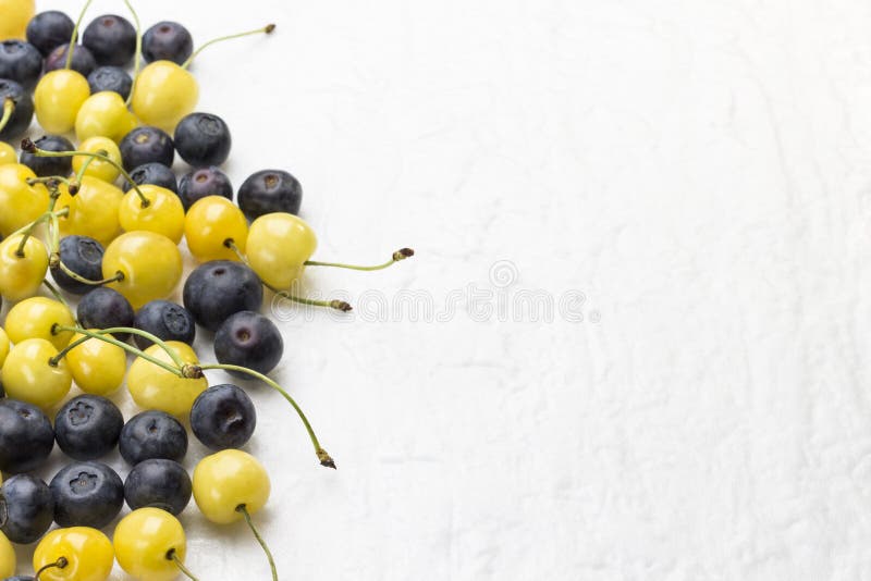 Yellow Cherry and Blueberry on White Background Stock Image - Image of ...