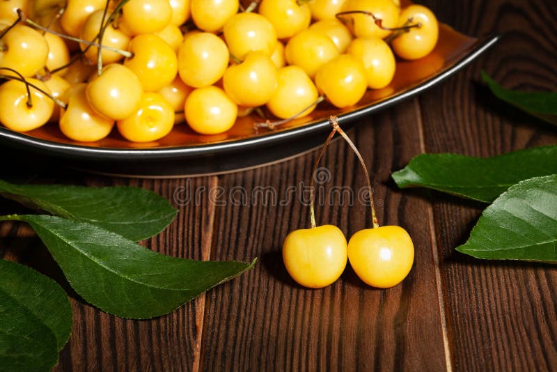 Yellow cherry on wood stock photo. Image of cherry, closeup - 259677076