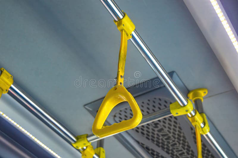 A Yellow City Bus Handle Grip Stock Image - Image of handgrip, plastic ...