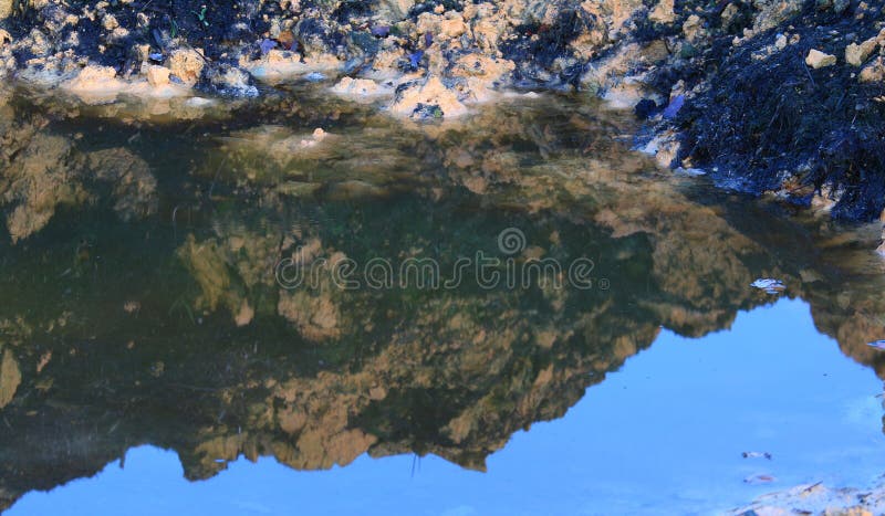 Yellow Clay is Reflected in a Puddle Stock Image - Image of nasty ...