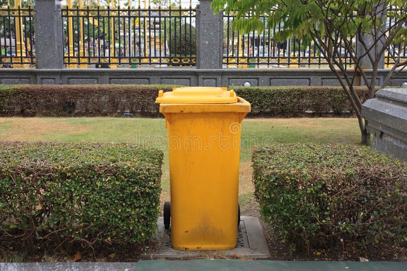 Yellow clean garbage bin stock photo. Image of group - 30528512