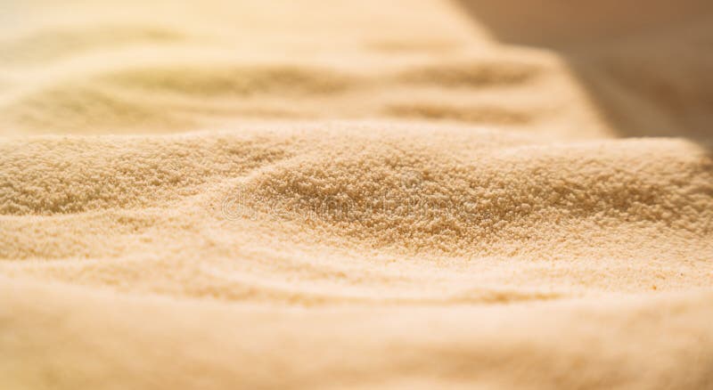 Yellow Clean Sand with Wavy Patterns Under Sunlight Stock Photo - Image ...