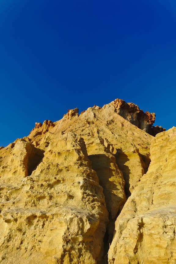 Yellow Cliffs with Blue Sky in Background Stock Photo - Image of ...