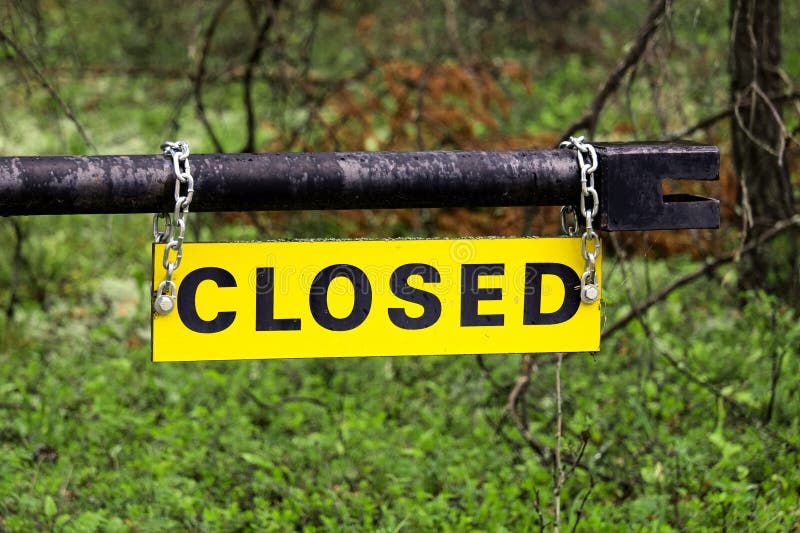 A Yellow Closed Sign on an Metal Gate Stock Image - Image of forest ...