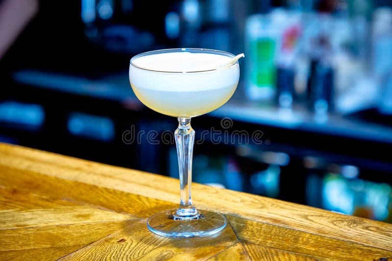 Yellow Cocktail with Foam on Top of the Glass Stock Photo - Image of ...