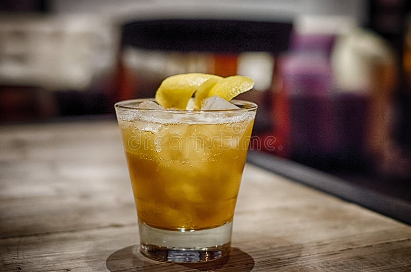 Yellow Cocktail on Wooden Table Stock Image - Image of orange, focus ...