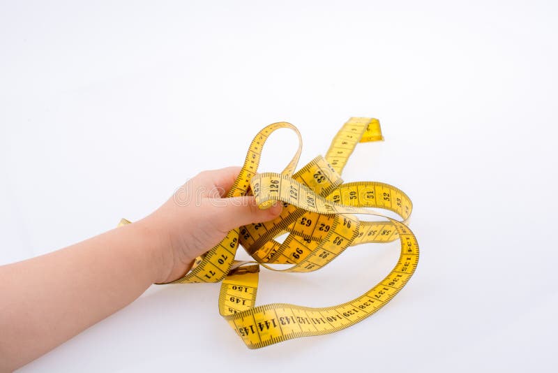Yellow Color Measuring Tape in Hand Stock Photo - Image of holding ...