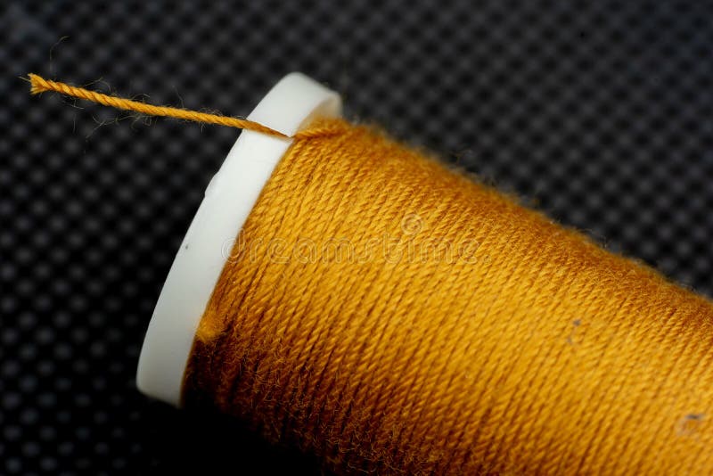 Yellow Colored Fabric Sewing Thread Roll with Visible Lines. Stock ...