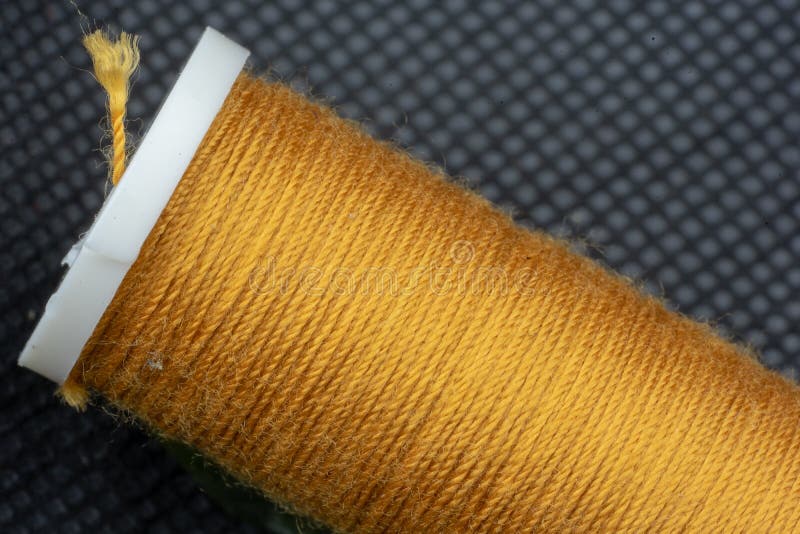 Yellow Colored Fabric Sewing Thread Roll with Visible Lines. Stock ...