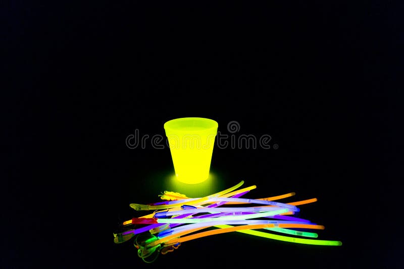 Yellow Colored Fluorescent Glass with Glow Sticks Lights Stock Image ...