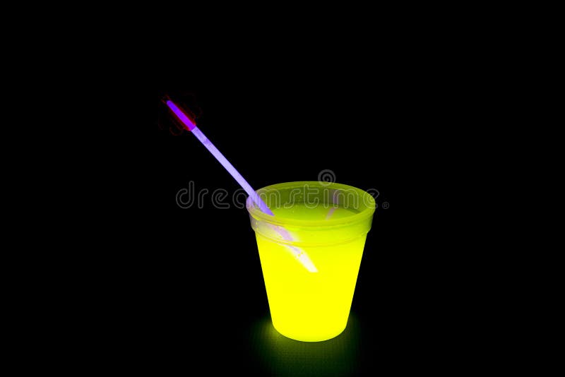 Yellow Colored Fluorescent Glass with Glow Sticks Lights Stock Image ...