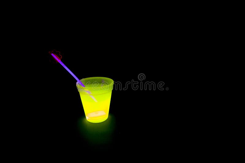 Yellow Colored Fluorescent Glass with Glow Sticks Lights Stock Image ...