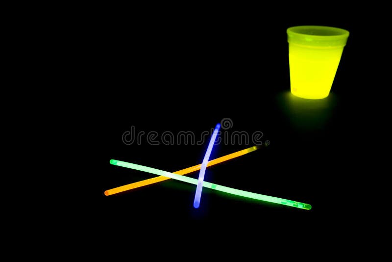 Yellow Colored Fluorescent Glass with Glow Sticks Lights Stock Photo ...