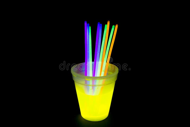 Yellow Colored Fluorescent Glass with Glow Sticks Lights Stock Photo ...