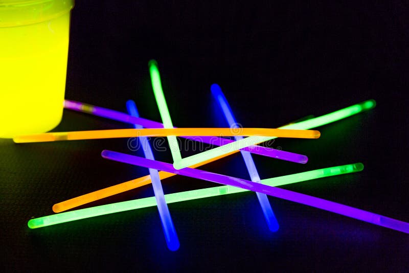 Yellow Colored Fluorescent Glass with Glow Sticks Lights Stock Image ...