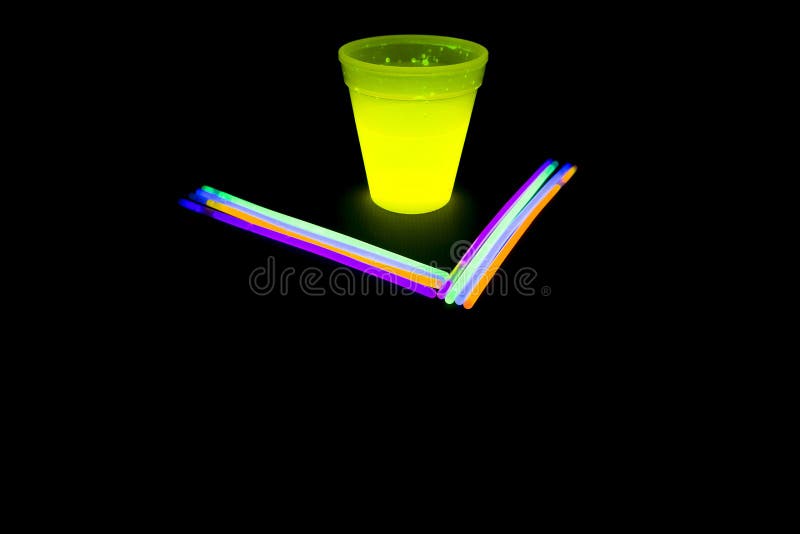 Yellow Colored Fluorescent Glass with Glow Sticks Lights Stock Image ...
