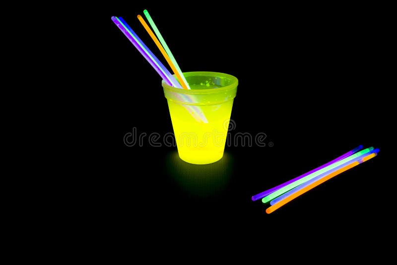 Yellow Colored Fluorescent Glass with Glow Sticks Lights Stock Image ...
