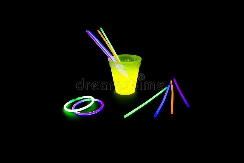 Yellow Colored Fluorescent Glass with Glow Sticks Lights Stock Photo ...