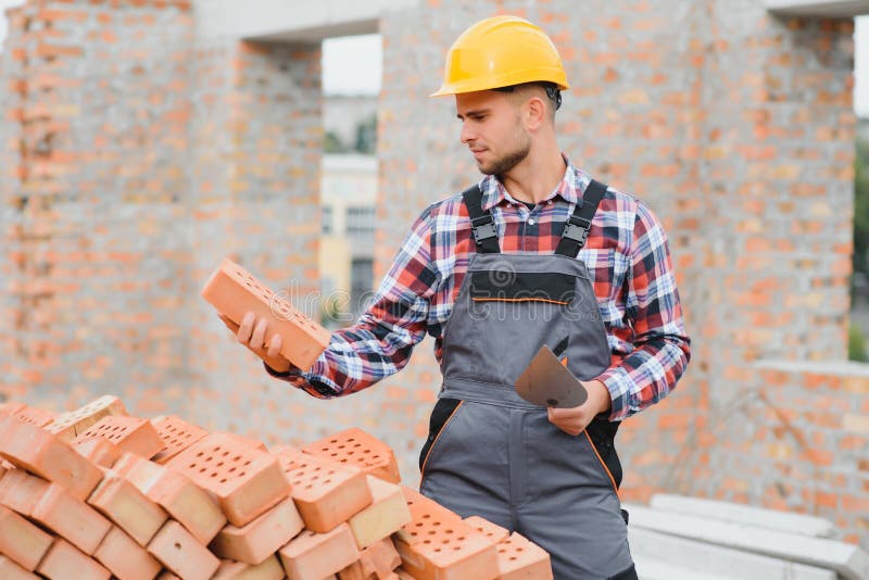 Yellow Colored Hard Hat. Young Man Working in Uniform at Construction ...