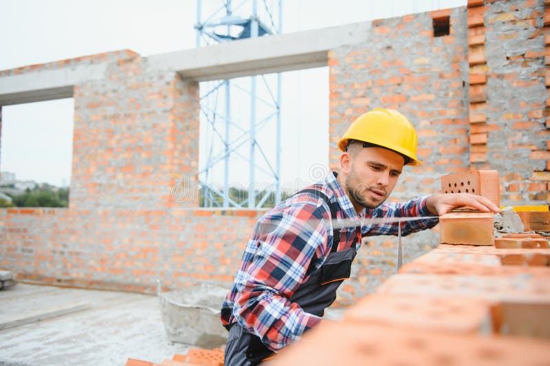 Yellow Colored Hard Hat. Young Man Working in Uniform at Construction ...