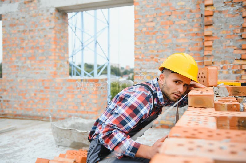 Yellow Colored Hard Hat. Young Man Working in Uniform at Construction ...