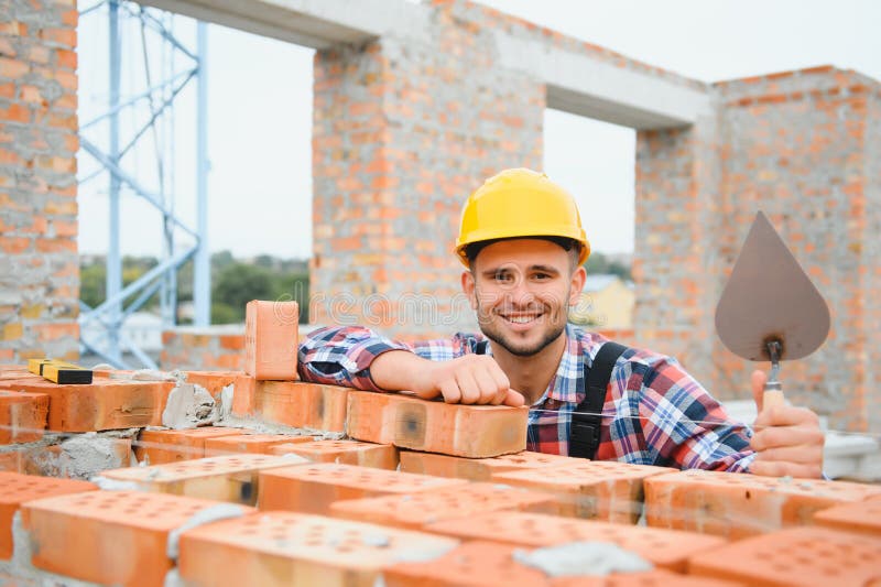 Yellow Colored Hard Hat. Young Man Working in Uniform at Construction ...