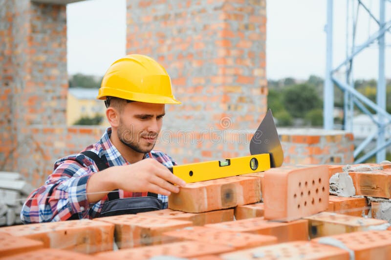 Yellow Colored Hard Hat. Young Man Working in Uniform at Construction ...