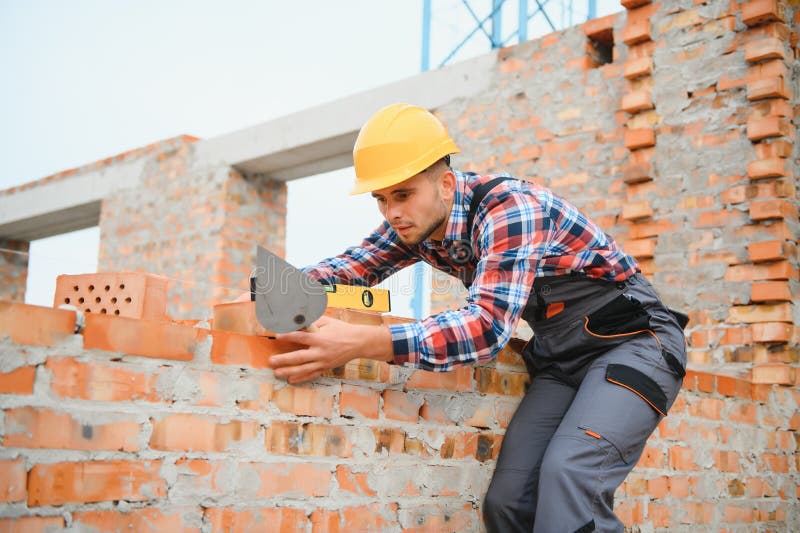 Yellow Colored Hard Hat. Young Man Working in Uniform at Construction ...