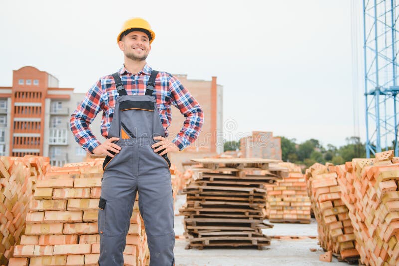 Yellow Colored Hard Hat. Young Man Working in Uniform at Construction ...