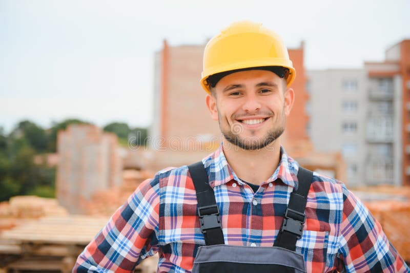 Yellow Colored Hard Hat. Young Man Working in Uniform at Construction ...