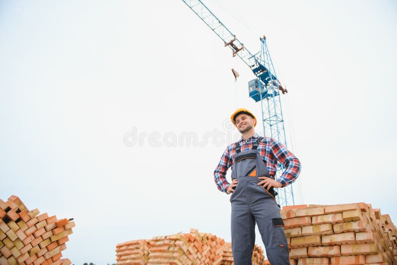 Yellow Colored Hard Hat. Young Man Working in Uniform at Construction ...