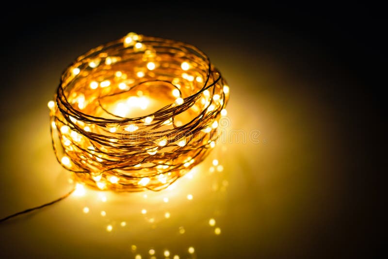 Yellow Colored Light Chain for Decoration Placed on a Reflective ...