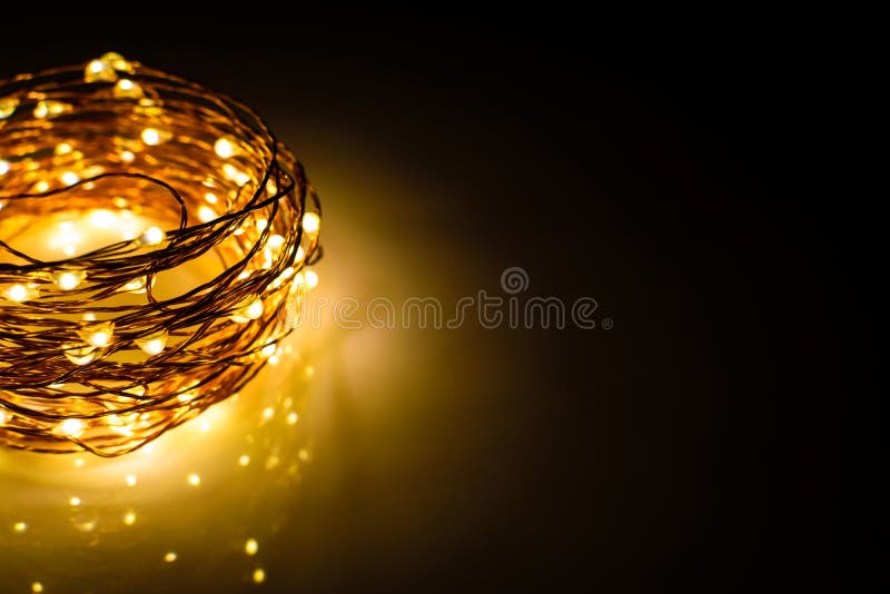 Yellow Colored Light Chain for Decoration Placed on a Reflective ...