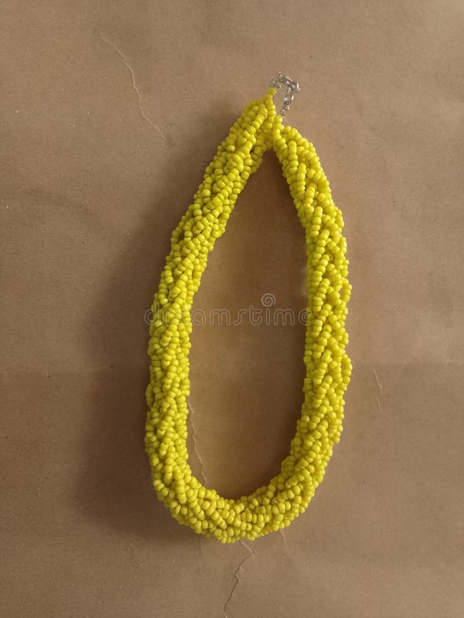Yellow colour seed bead stock photo. Image of stone - 277013014